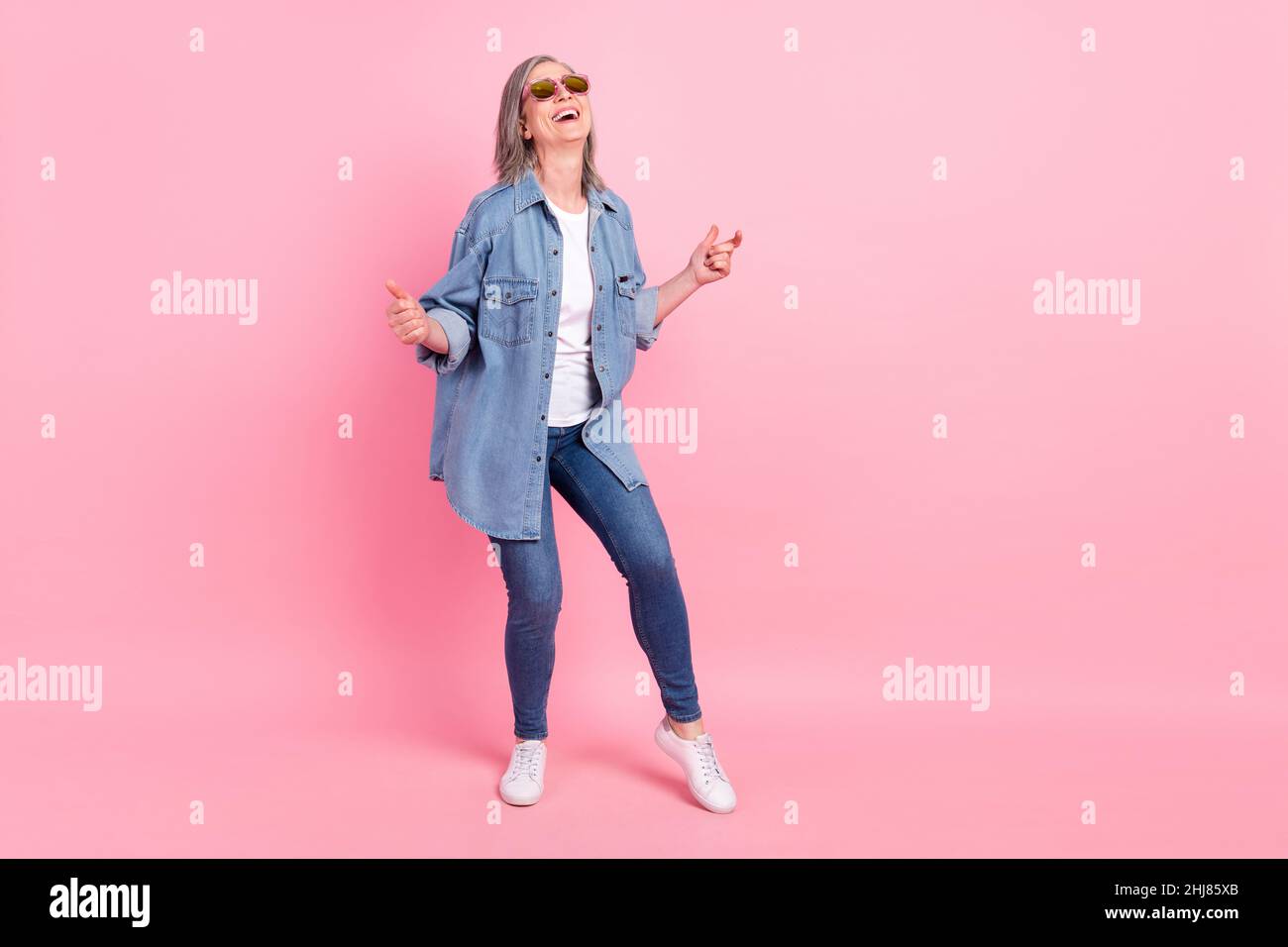 Full size photo of astonished elder lady dance wear blue jacket jeans ...