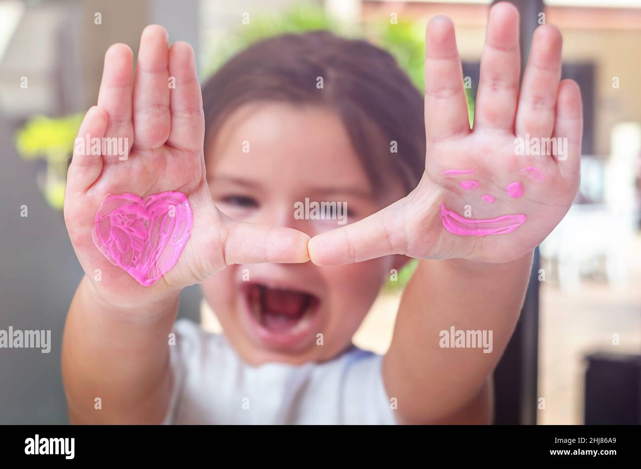 Child girl shows hands on which a heart and a smile are drawn Stock ...
