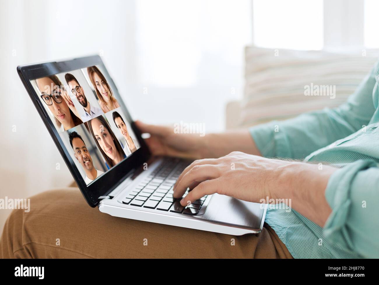 man with laptop having video call with colleagues Stock Photo - Alamy