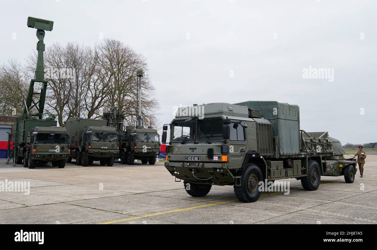 The old Rapier missile system (right) is driven past the new Sky Sabre ...