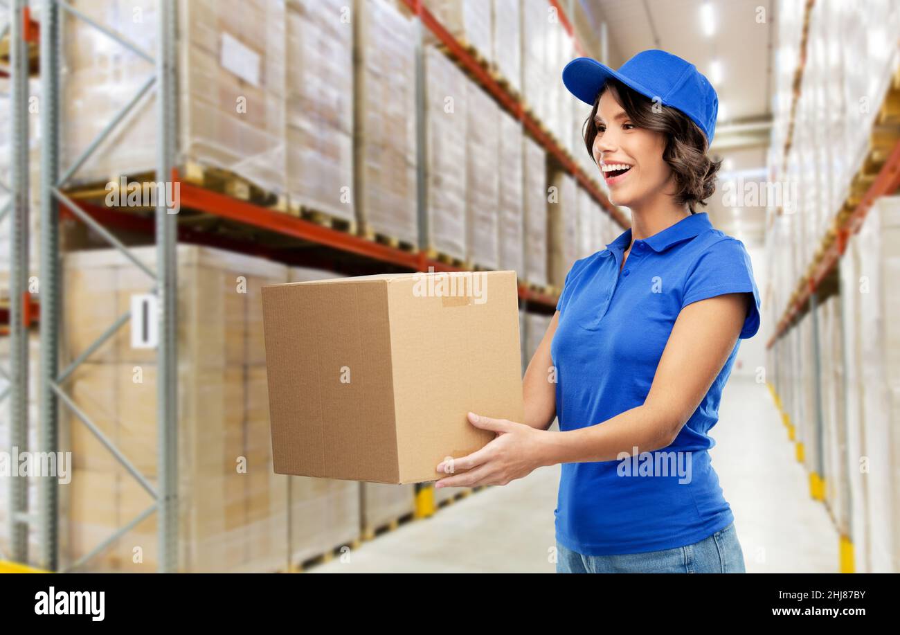 happy delivery girl with parcel box at warehouse Stock Photo - Alamy