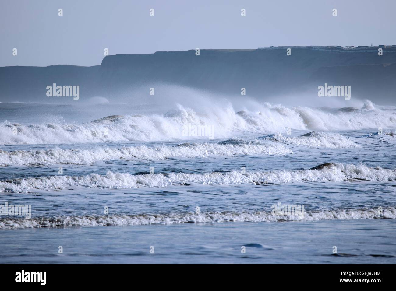 Winter waves pound the North Sea coast and undercut cliffs and cause ...