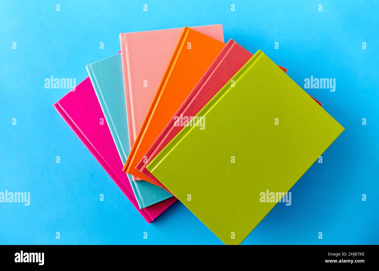 Pile of notebooks blue hi-res stock photography and images - Alamy