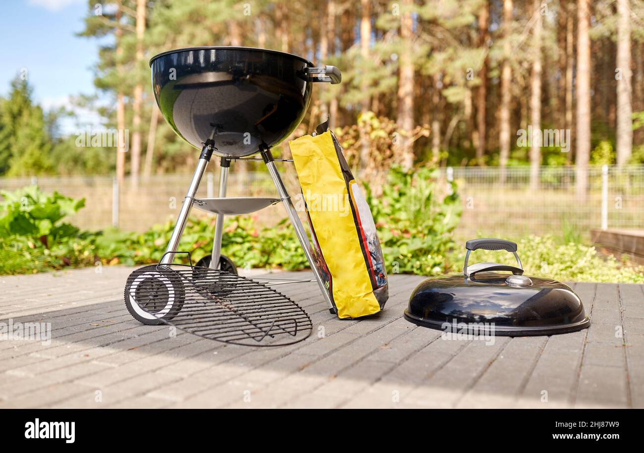 bbq grill brazier and bag of charcoal outdoors Stock Photo - Alamy
