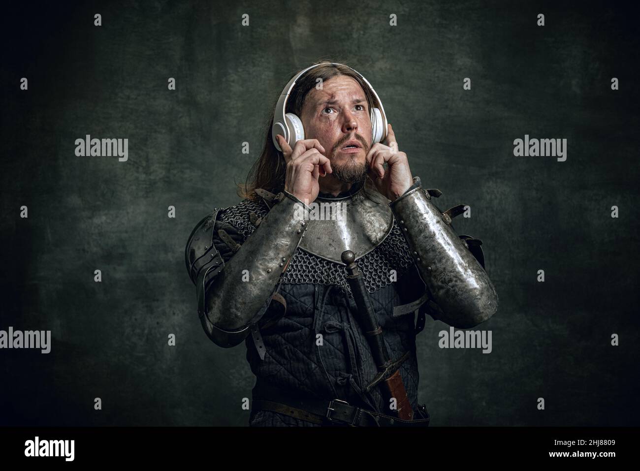 Shocked medieval warrior or knight with dirty wounded face in ...