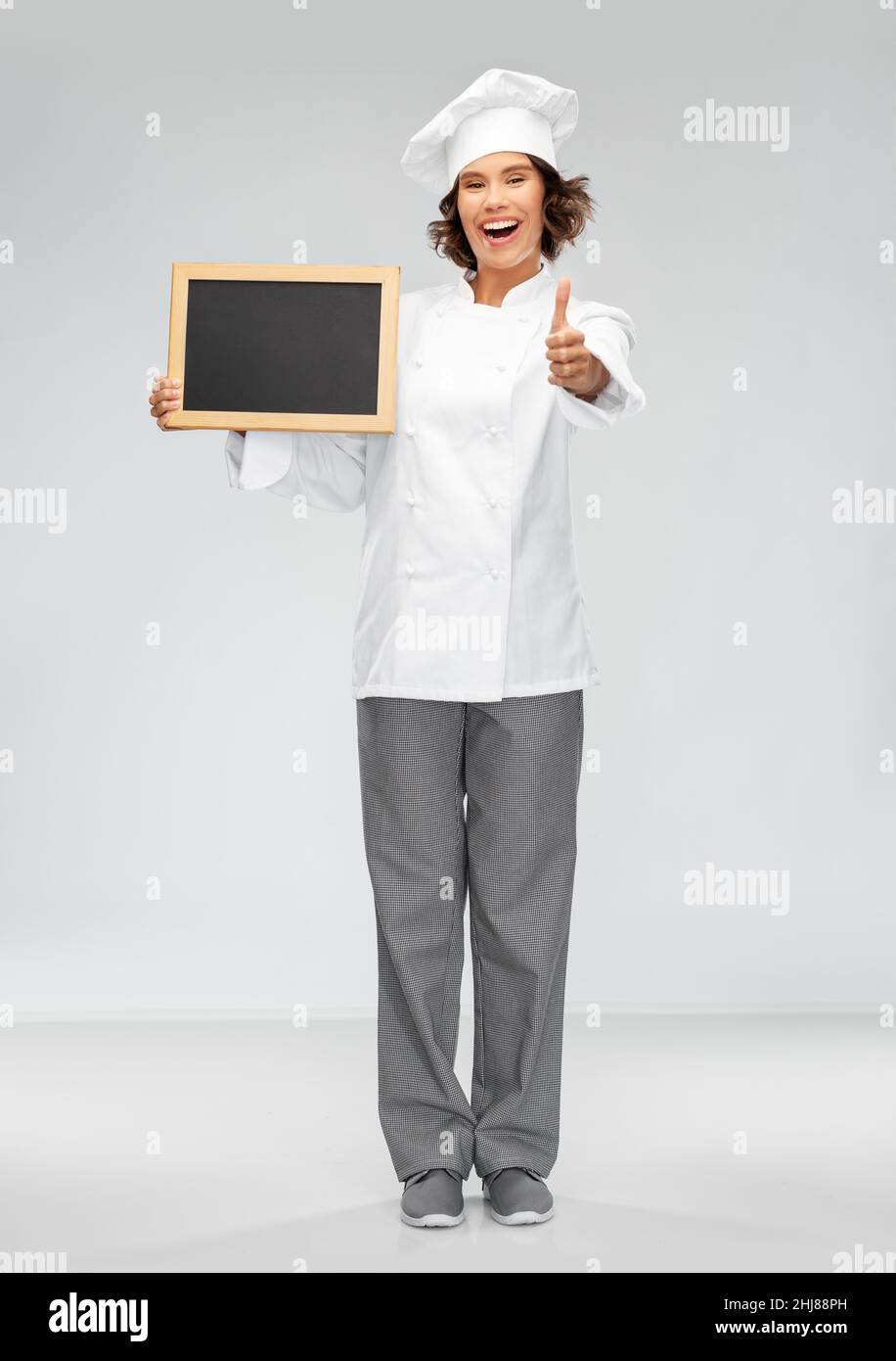 happy chef with chalkboard showing thumbs up Stock Photo - Alamy