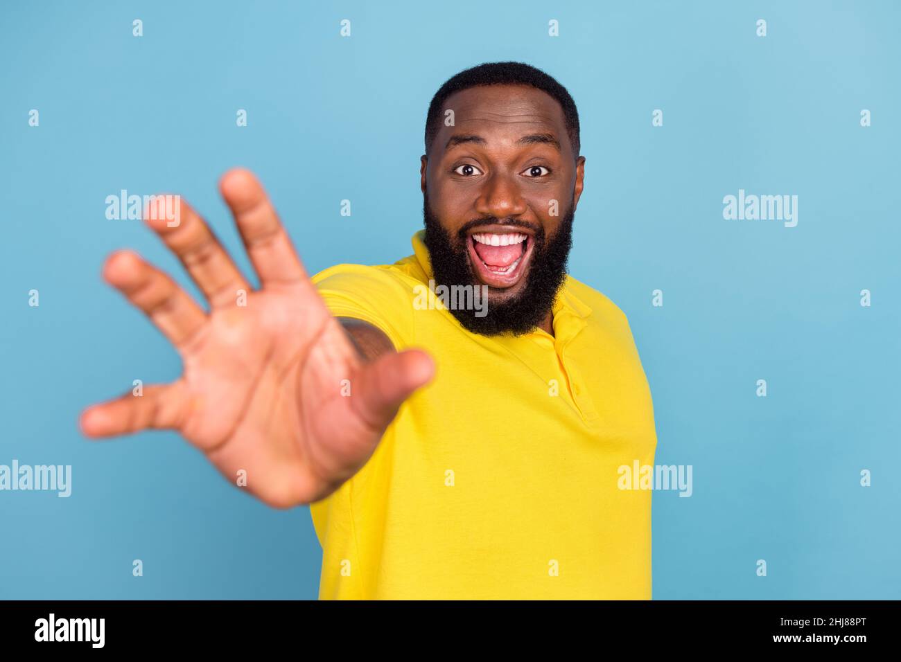 Photo of shocked funny dark skin man wear yellow t-shirt smiling ...