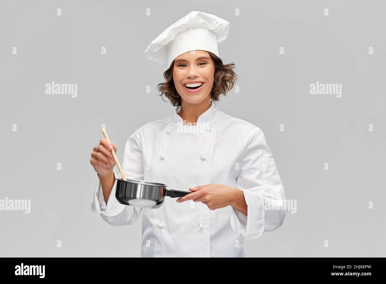 happy smiling female chef with saucepan Stock Photo - Alamy