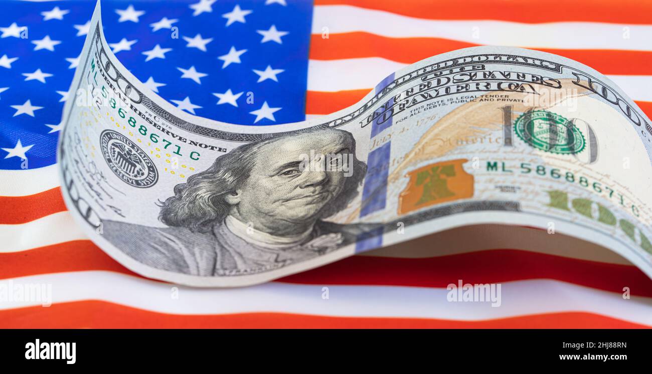 U.S. 100 dollar banknote on american flag background for design purpose ...
