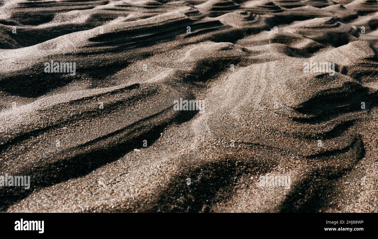 Unusual shapes made in the sand from the retreating sea Stock Photo - Alamy