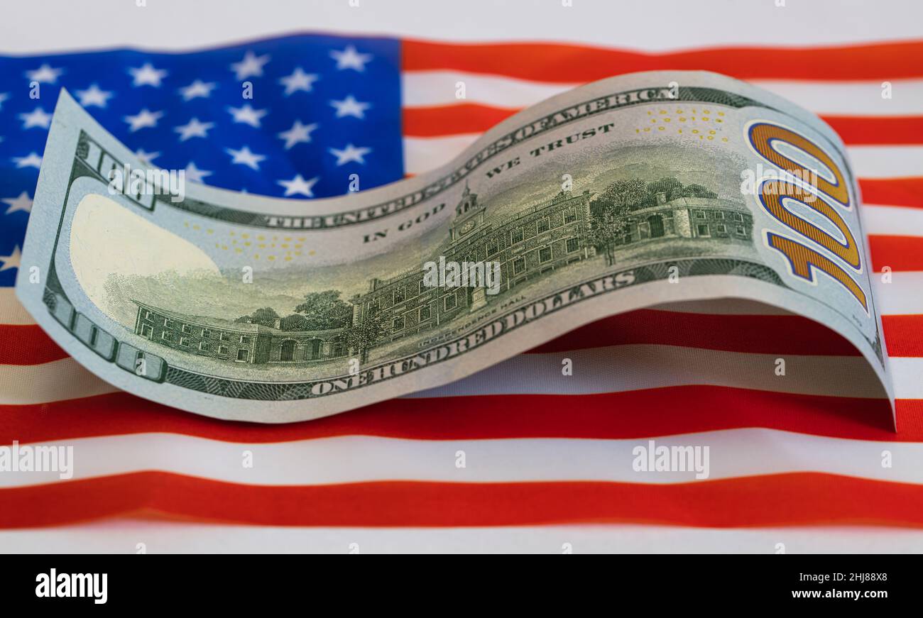 U.S. 100 dollar banknote on american flag background for design purpose ...