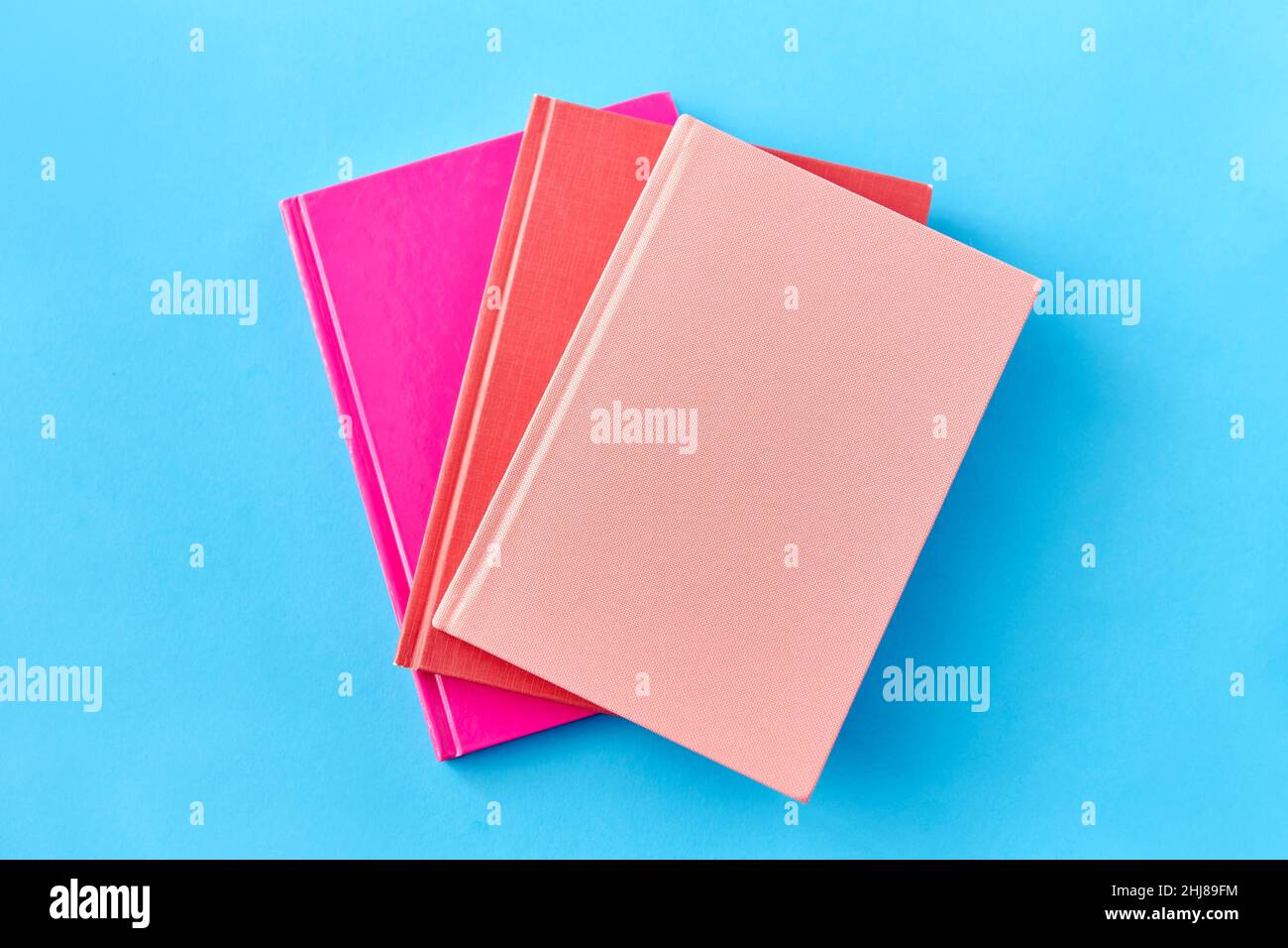 Pile of notebooks blue hi-res stock photography and images - Alamy