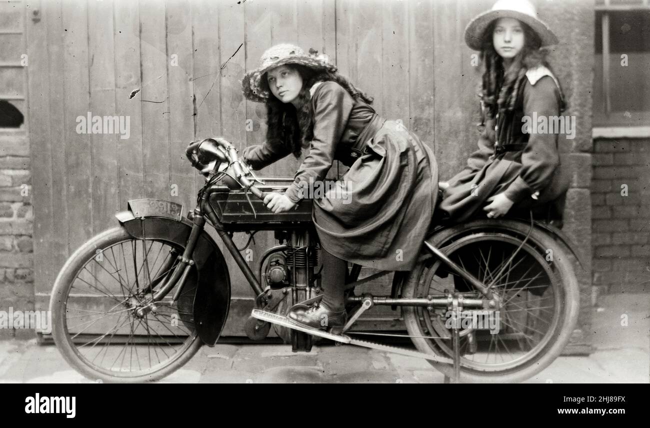 Two young ladies pose for a photograph sitting on a circa 1907 BAT ...