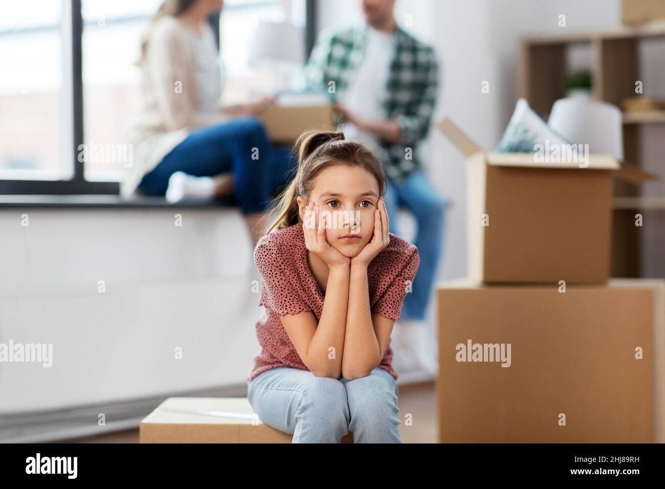 sad girl moving to new home with her family Stock Photo - Alamy