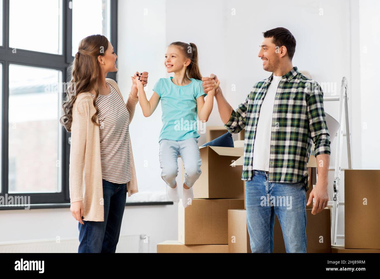 happy family with child moving to new home Stock Photo - Alamy