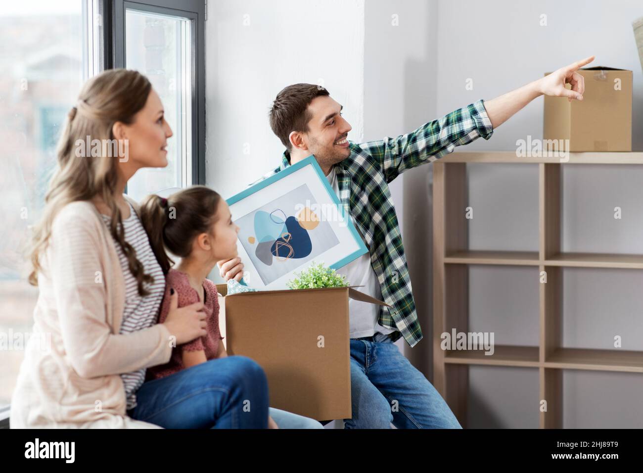happy family with child moving to new home Stock Photo - Alamy