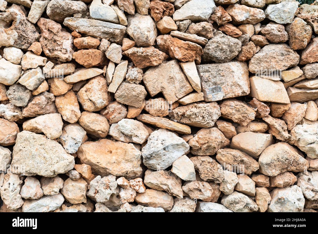 Traditional nature stone wall, with textured rock structure surface ...