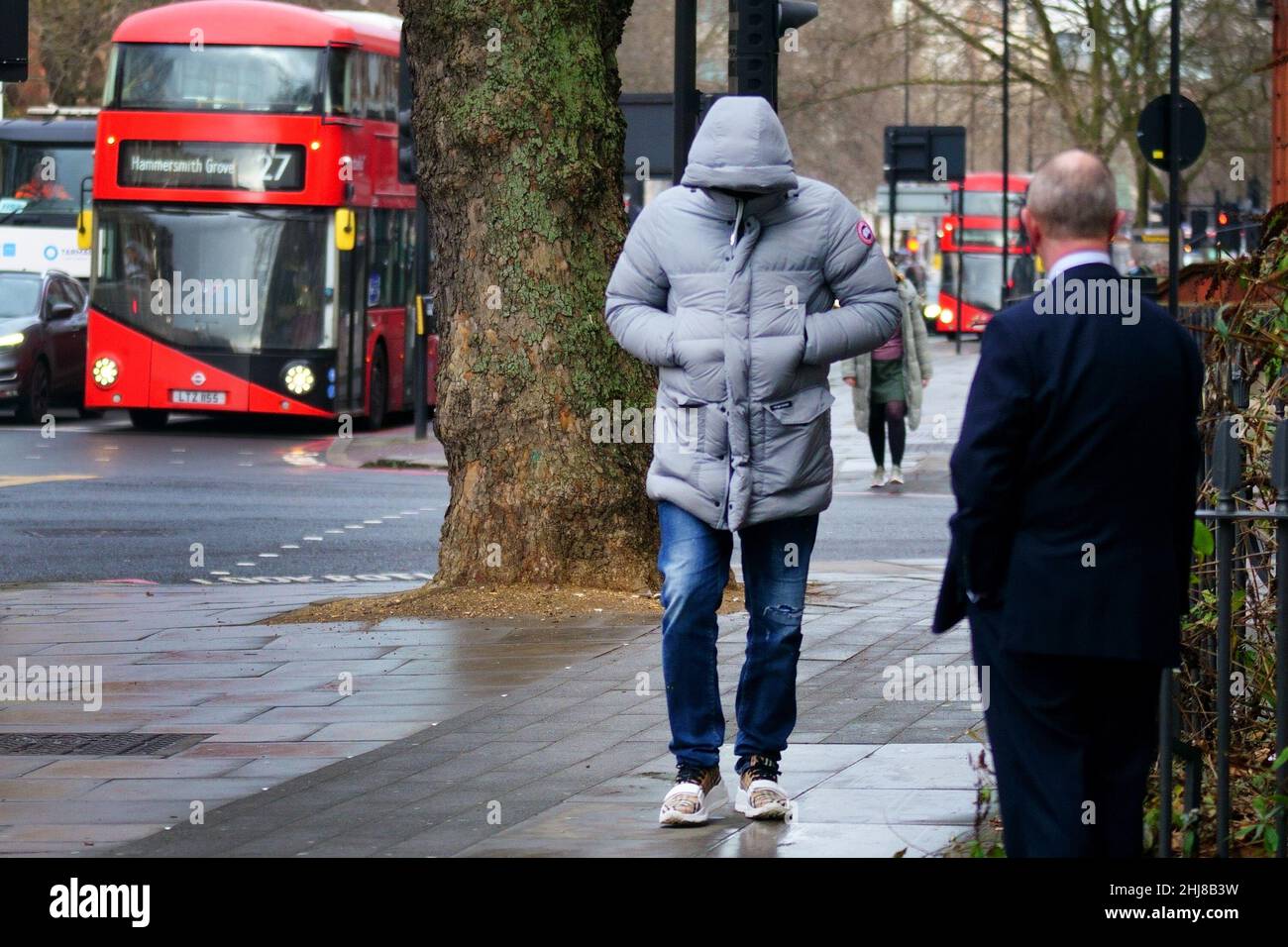Jonathan Chew covers up as he arrives at Westminster Magistrates' Court ...