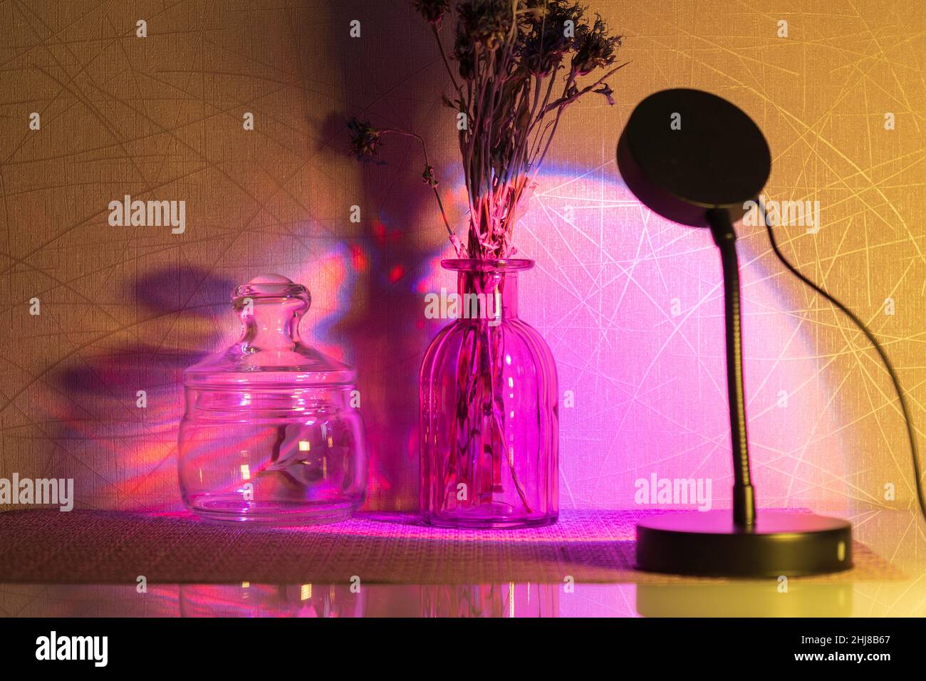 Sunset LED RGB lighting decor. Shadow on surface illuminated by ...