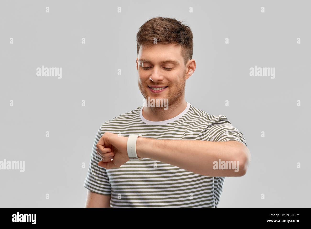 Happy looking at watch hi-res stock photography and images - Alamy