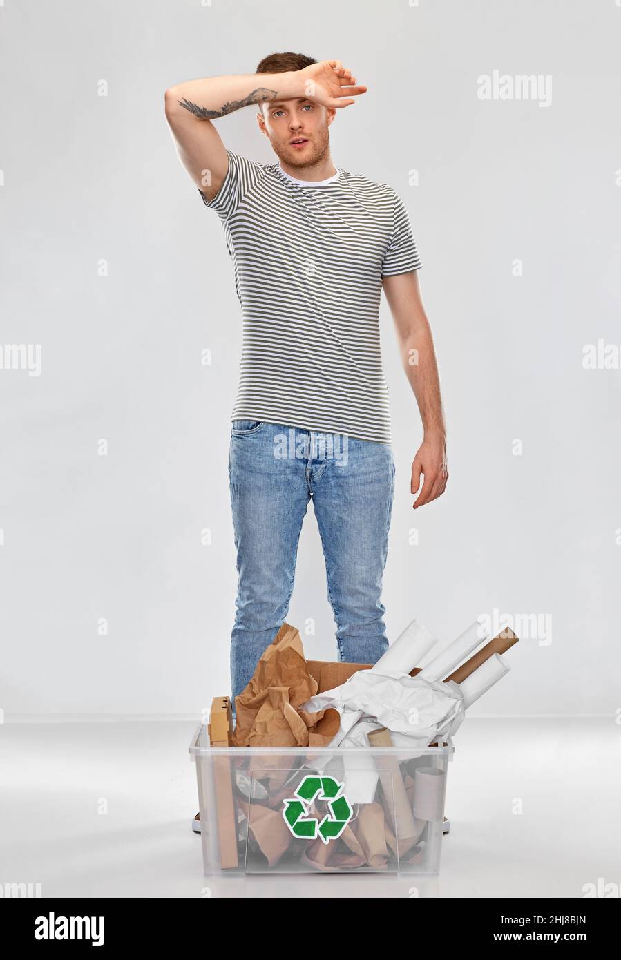 Young man sorting garbage hi-res stock photography and images - Alamy