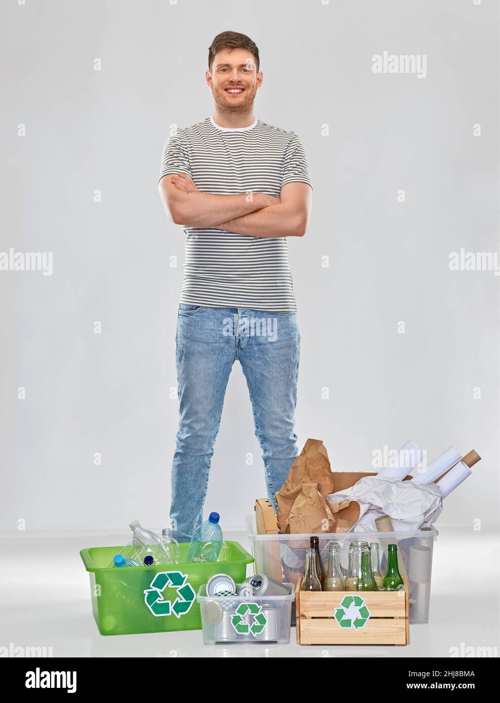 smiling man sorting paper, metal and plastic waste Stock Photo - Alamy
