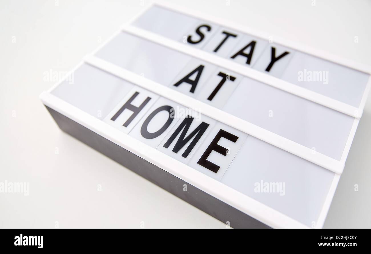 lightbox with stay at home caution words Stock Photo - Alamy
