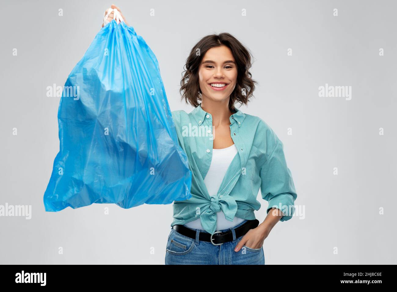 Woman trash bag ecology hi-res stock photography and images - Alamy