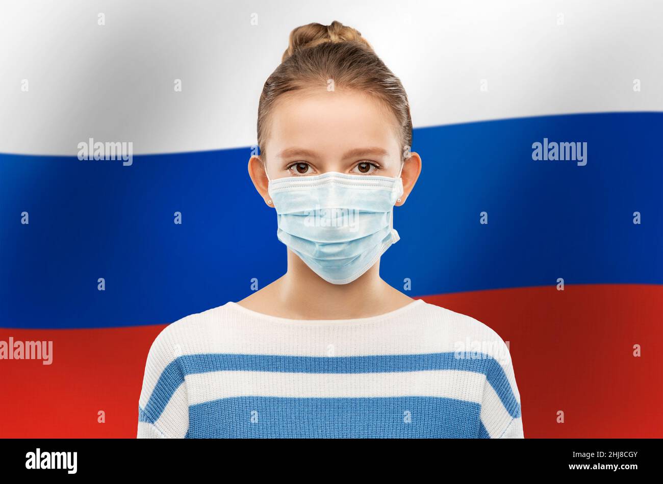 teenage girl in medical mask over flag of russia Stock Photo - Alamy