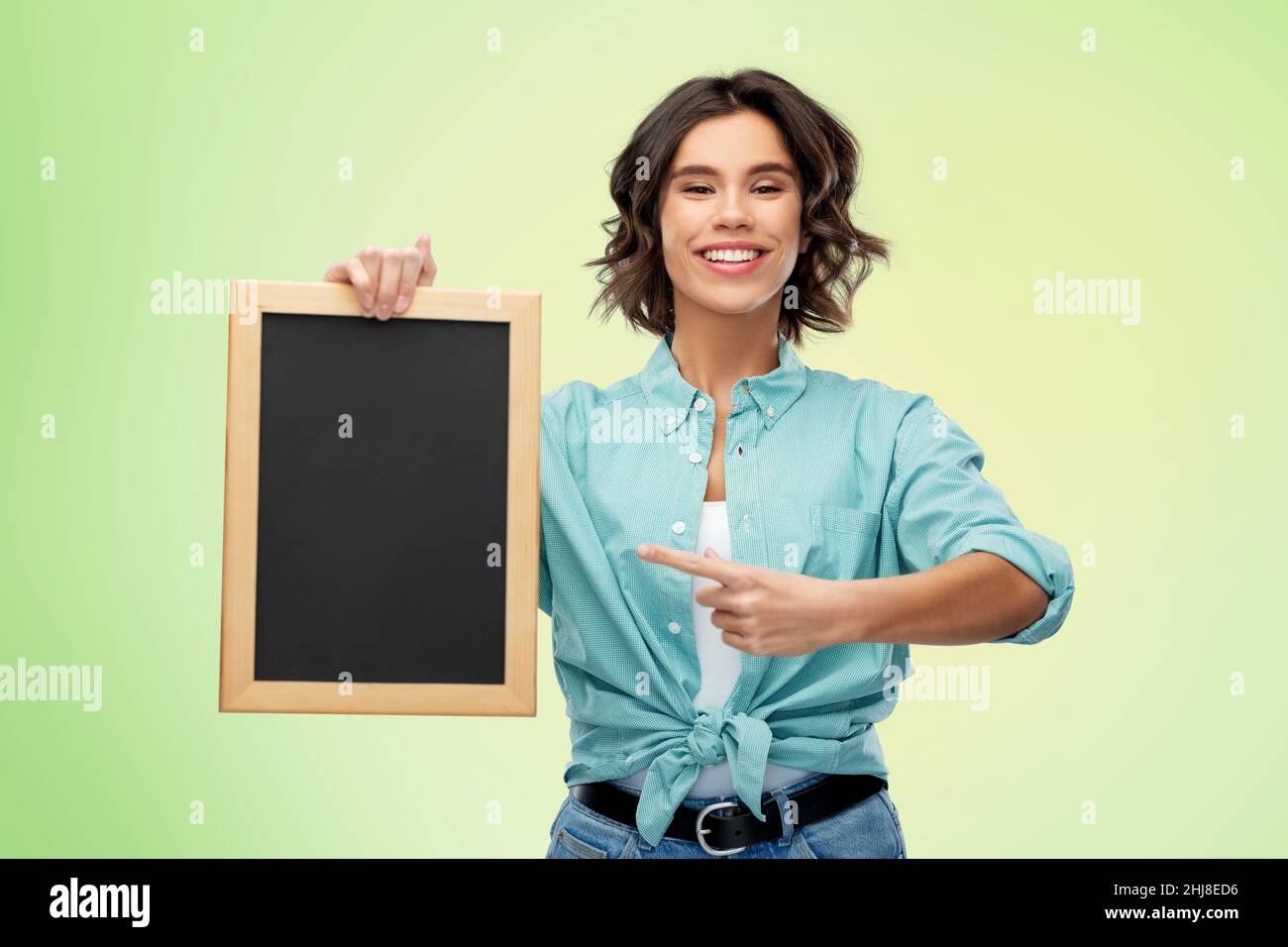 Woman holding black chalkboard hi-res stock photography and images - Alamy