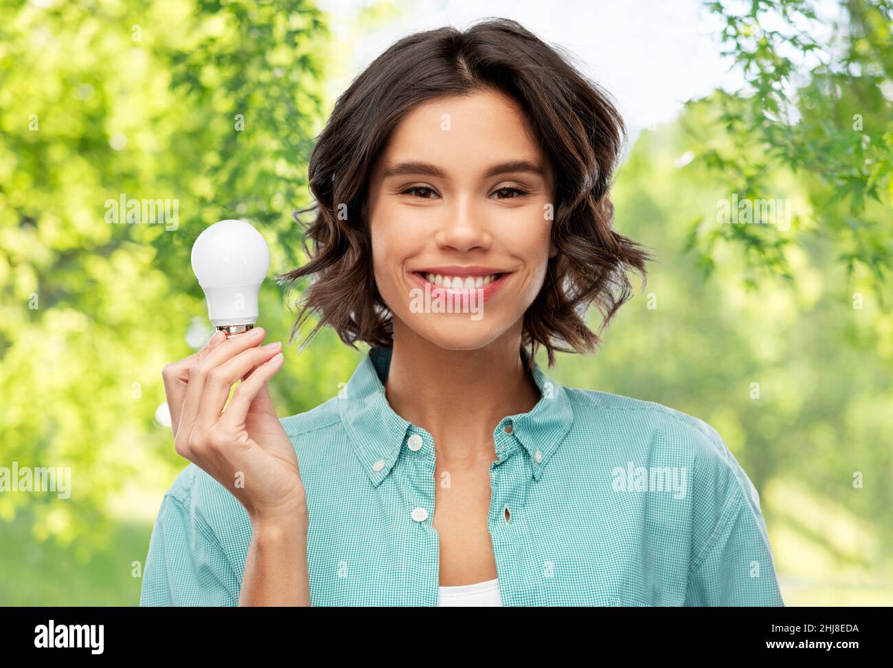 Woman light bulb holding bright hi-res stock photography and images - Alamy