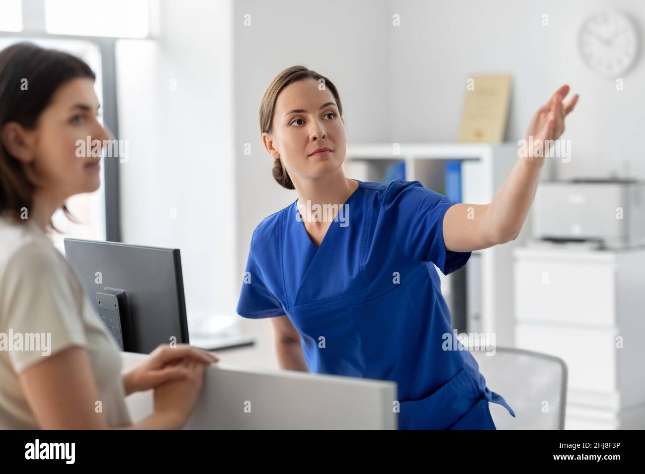 Doctor sitting desk showing hi-res stock photography and images - Alamy