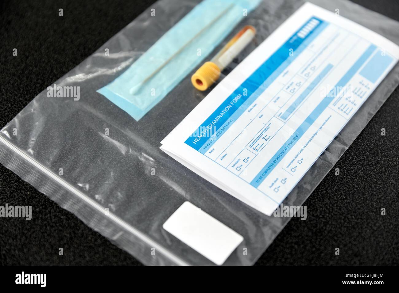 beaker with test, cotton swab and medical report Stock Photo - Alamy