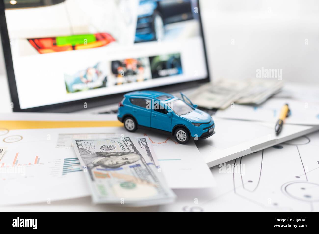 toy car and sheets drawings, money Stock Photo - Alamy