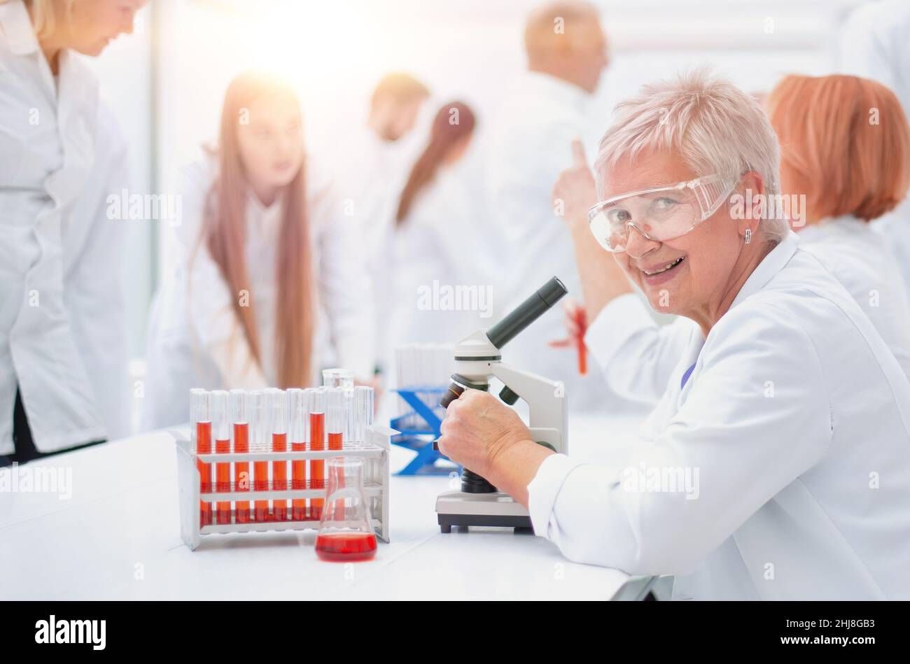 Scientist sitting at his desk hi-res stock photography and images - Alamy