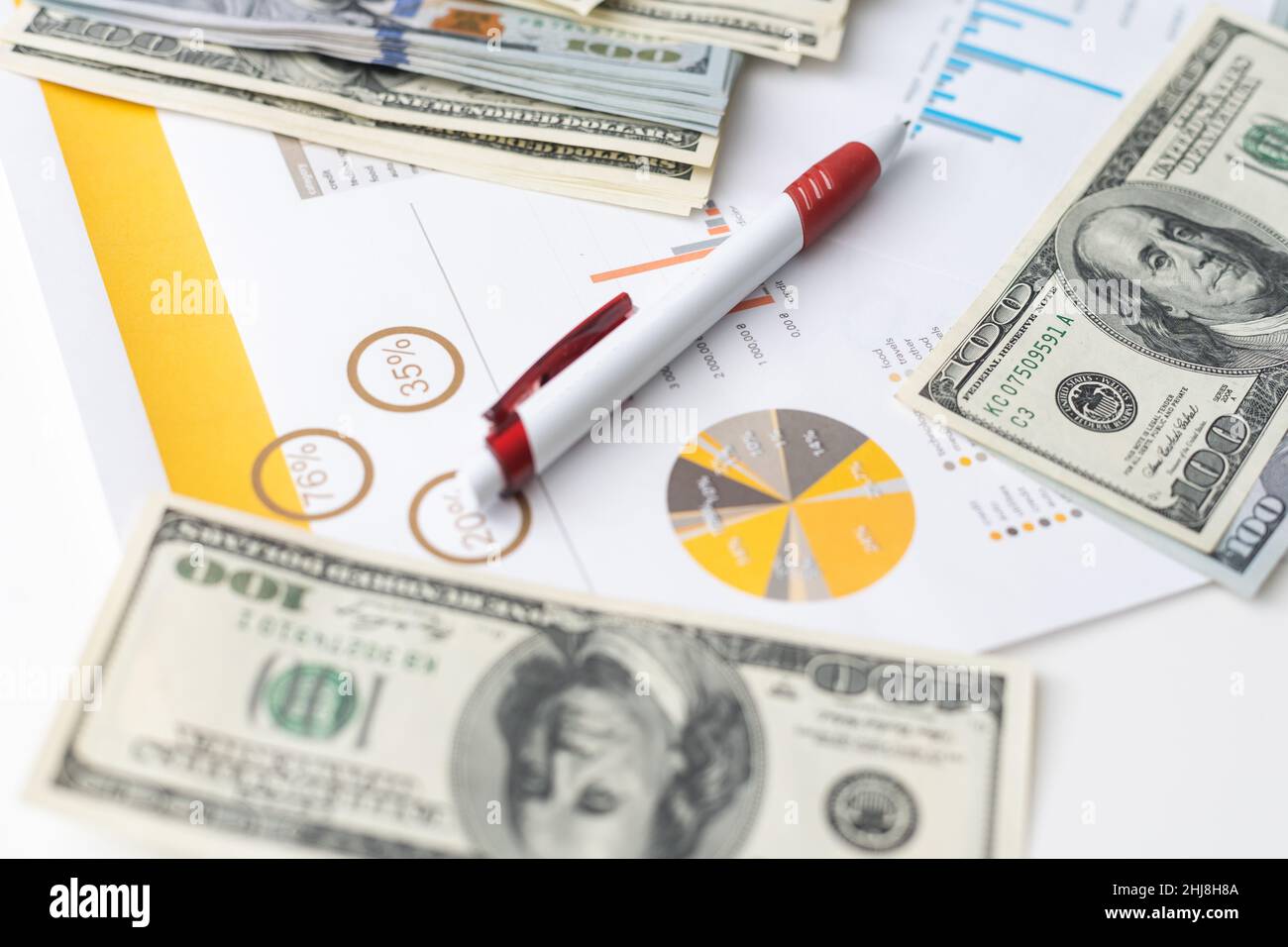 money concept, graph, chart document and pen on desktop Stock Photo - Alamy