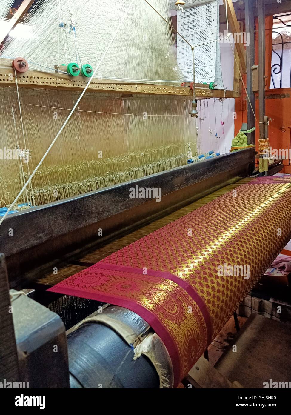 weaving of silk saree in weaving machine in Tamilnadu , India Stock ...
