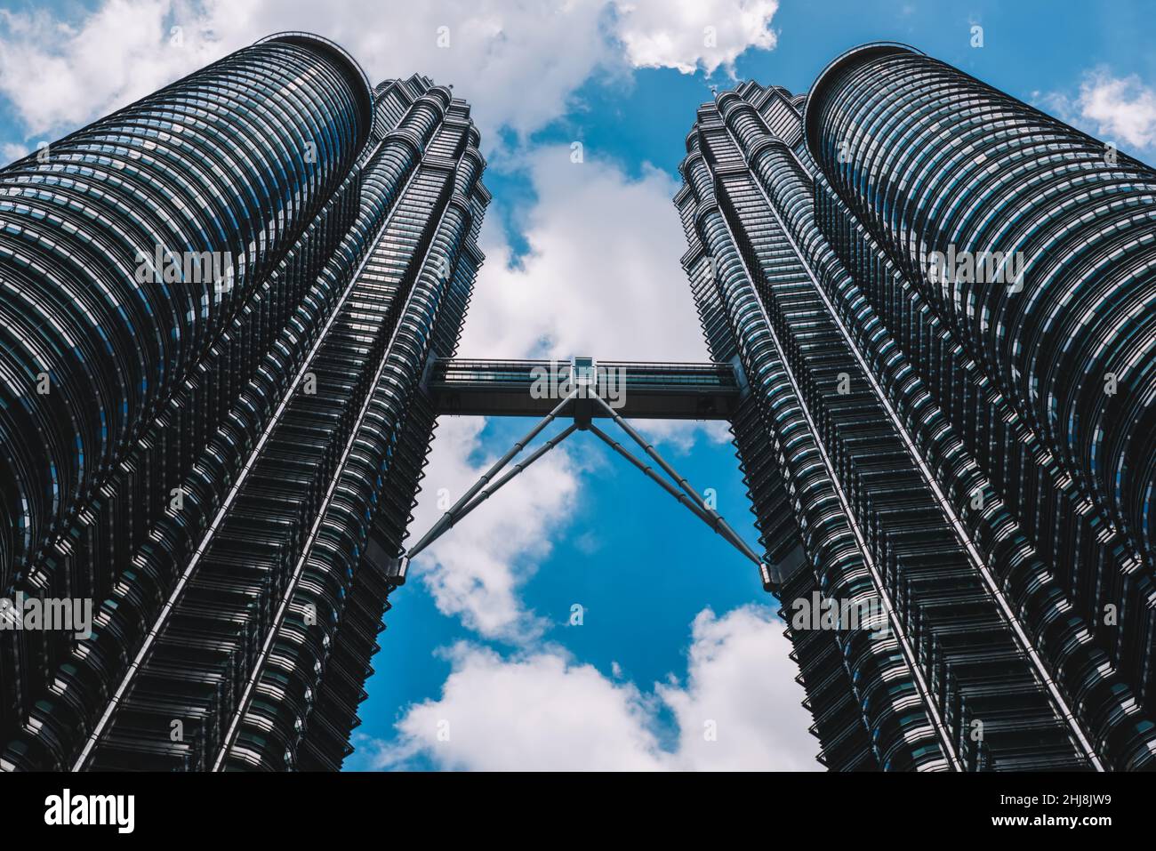Modern high towers in city under cloudy sky Stock Photo - Alamy
