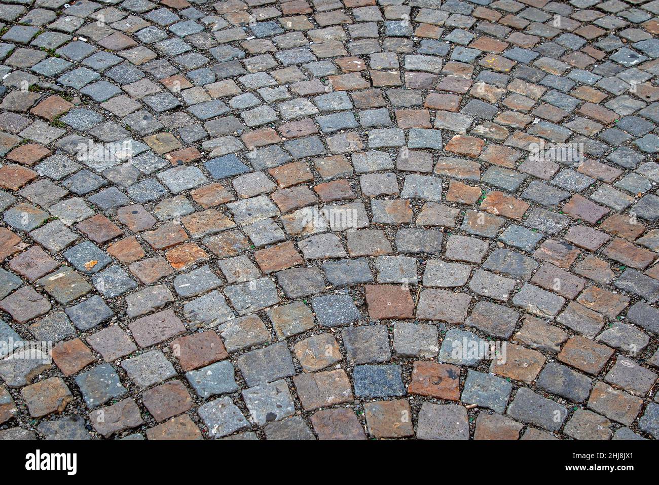 Stone cobble road pattern texture background wet after rain Stock Photo ...
