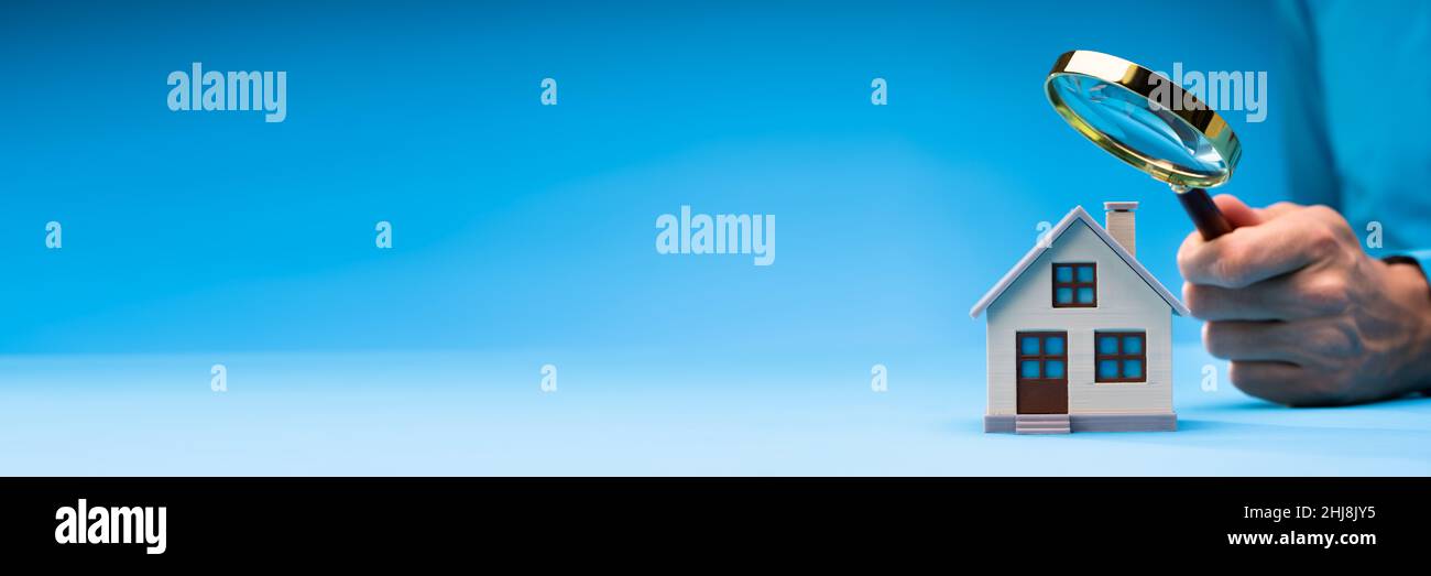 Real Estate House Inspector Checking Property Using Magnifying Glass ...