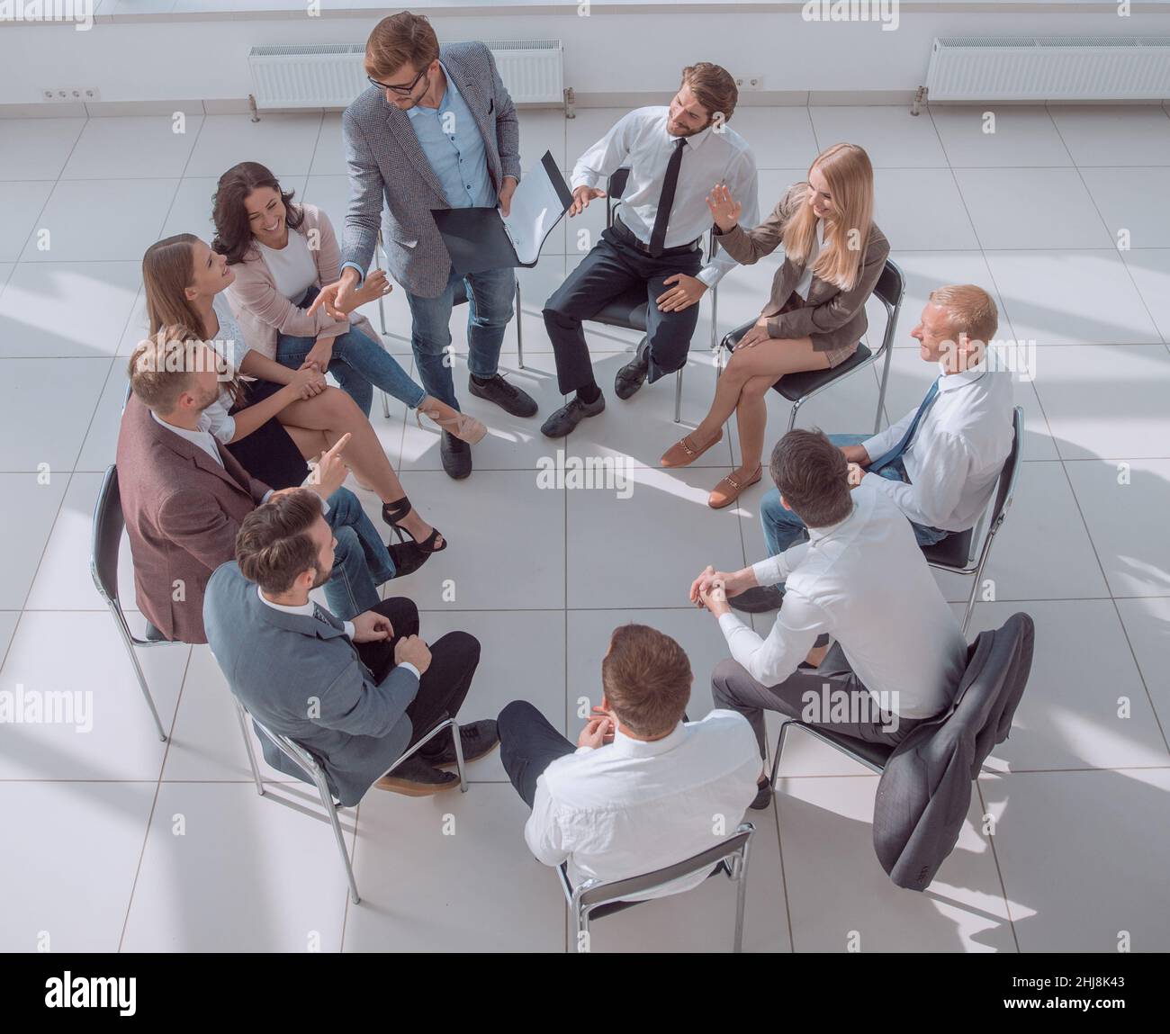 young employees ask questions during business training Stock Photo - Alamy