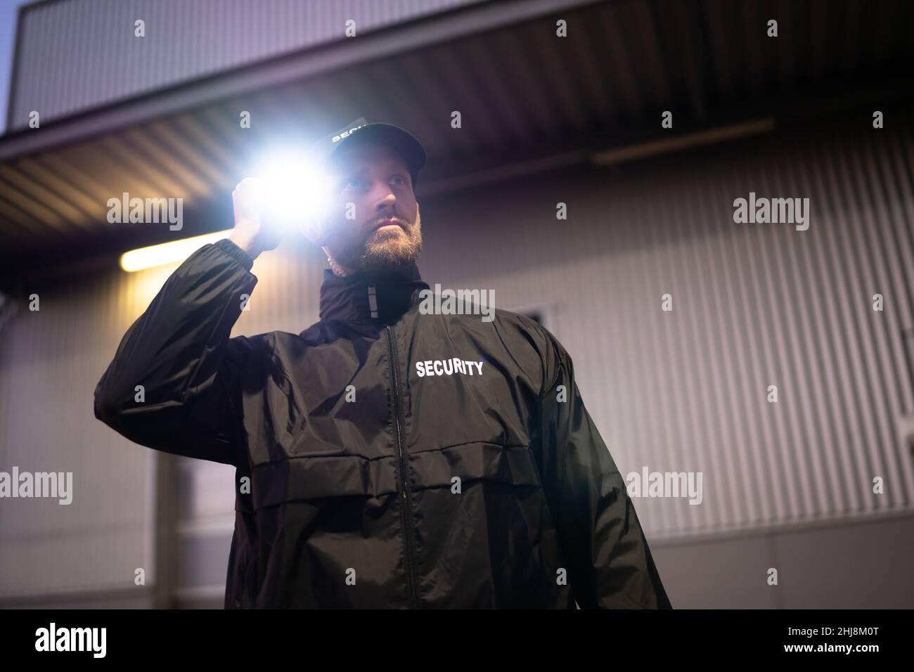 Security Guard Walking Building Perimeter With Flashlight At Night ...