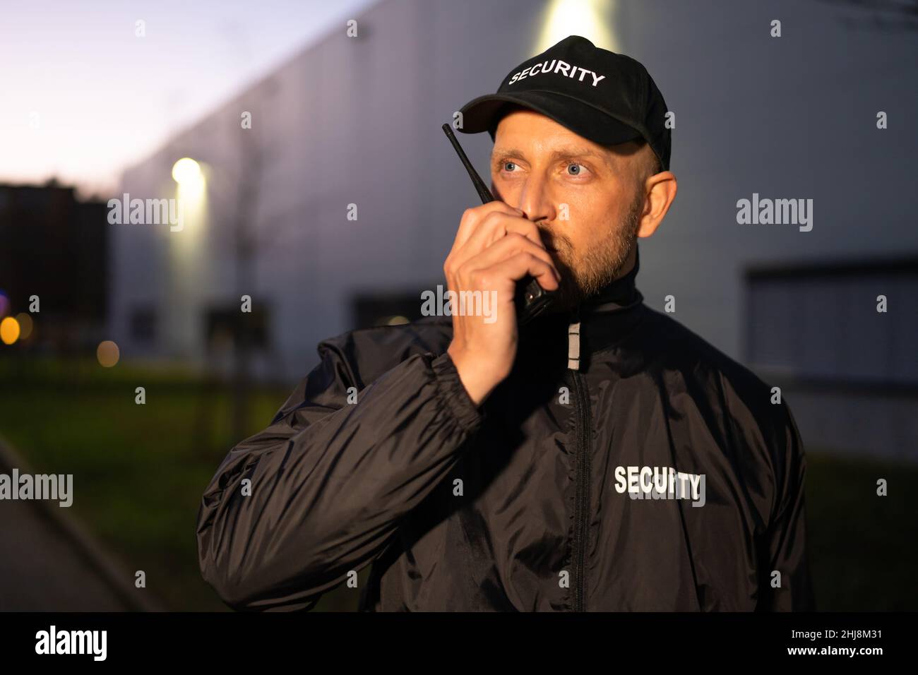 Security Guard Officer Using Walkie-Talkie Radio At Night Stock Photo ...