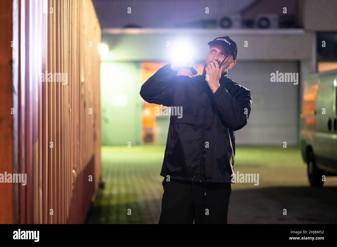 Security Guard At Cargo Container Storage Terminal At Night Stock Photo ...