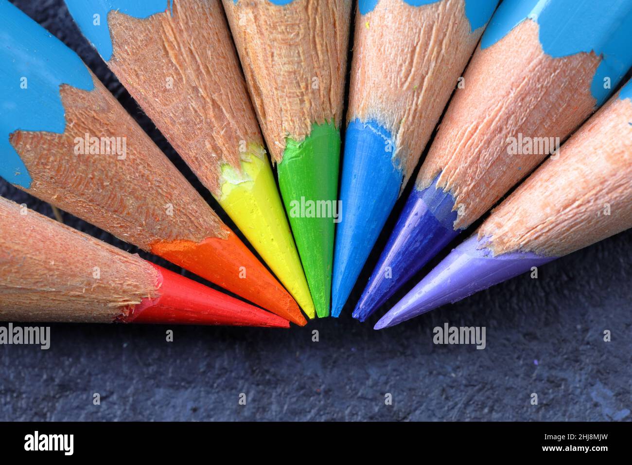 Brightly coloured pencils with sharp points in the colours of the ...