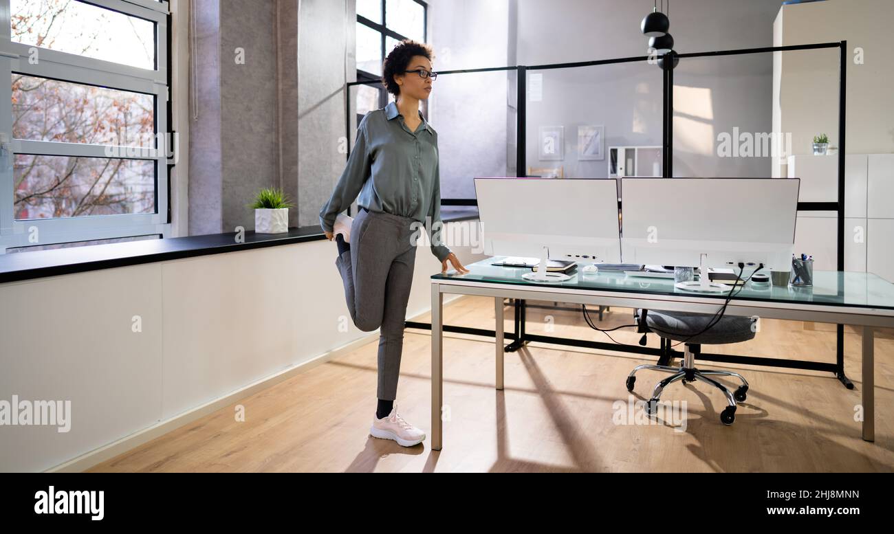 Yoga Office Workout And Gymnastics At Computer Business Desk Stock ...