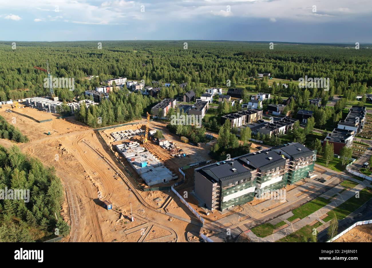 Suburb house construction in forest area. Home construction of ...