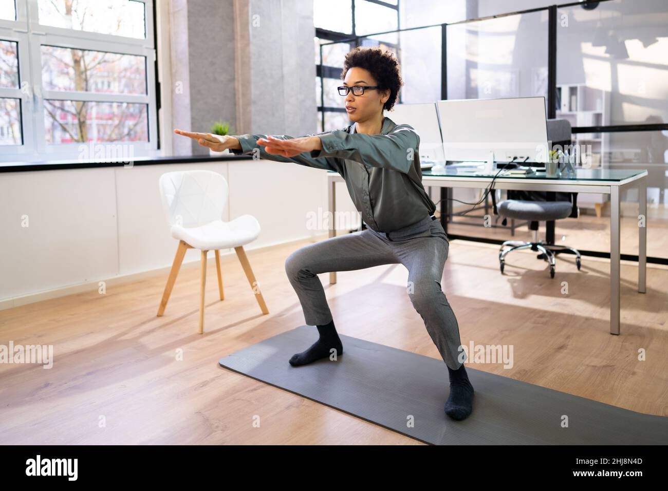 Healthy Standing Office Workout Near Business Computer Stock Photo - Alamy