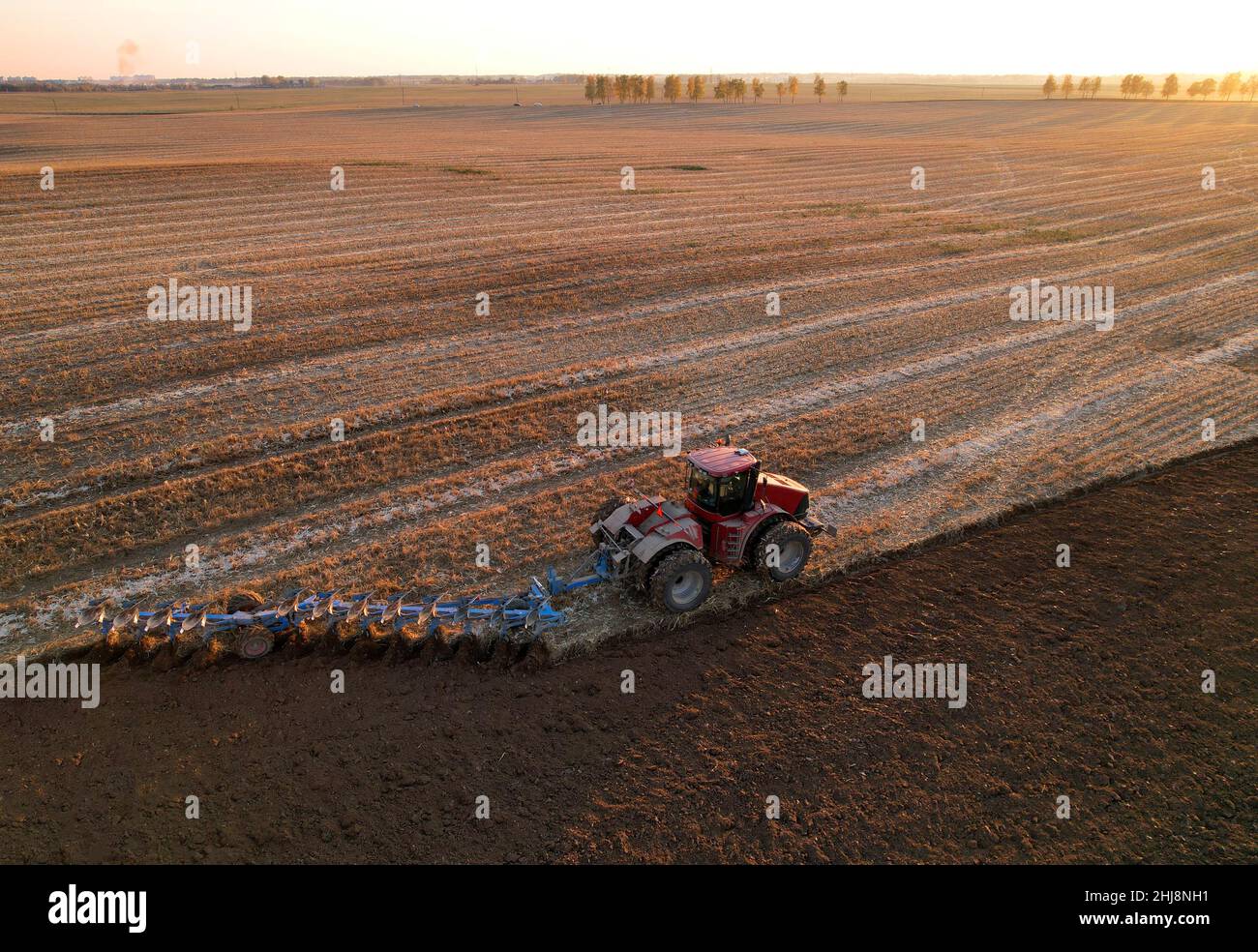 Tractor on plowed, aerial view. Ploughing and soil Tillage ...