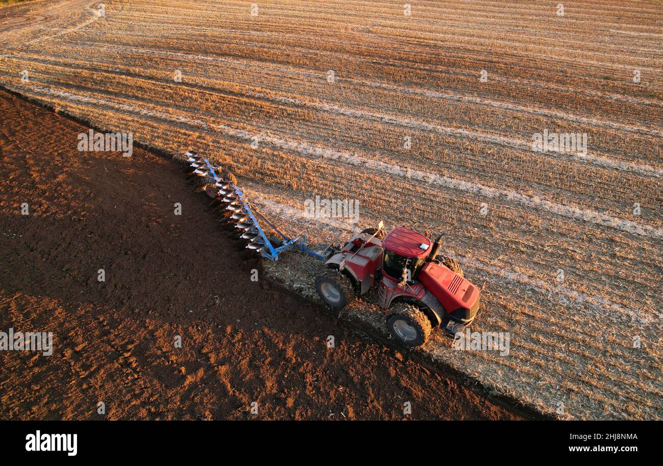 Tractor on plowed, aerial view. Ploughing and soil Tillage ...